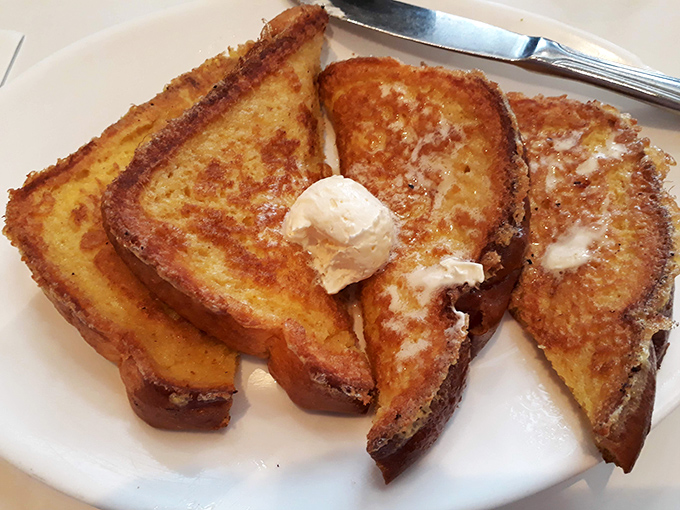 French toast that's had a tropical vacation. Those bananas didn't just fall on the plate&mdash;they were invited to the party.