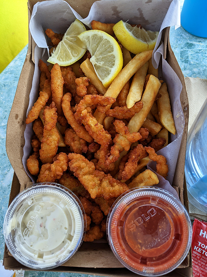 Fried clam strips and fries&mdash;the beach meal that time forgot. Crispy, golden, and served with dipping sauces that make you forget about fancy seafood towers.