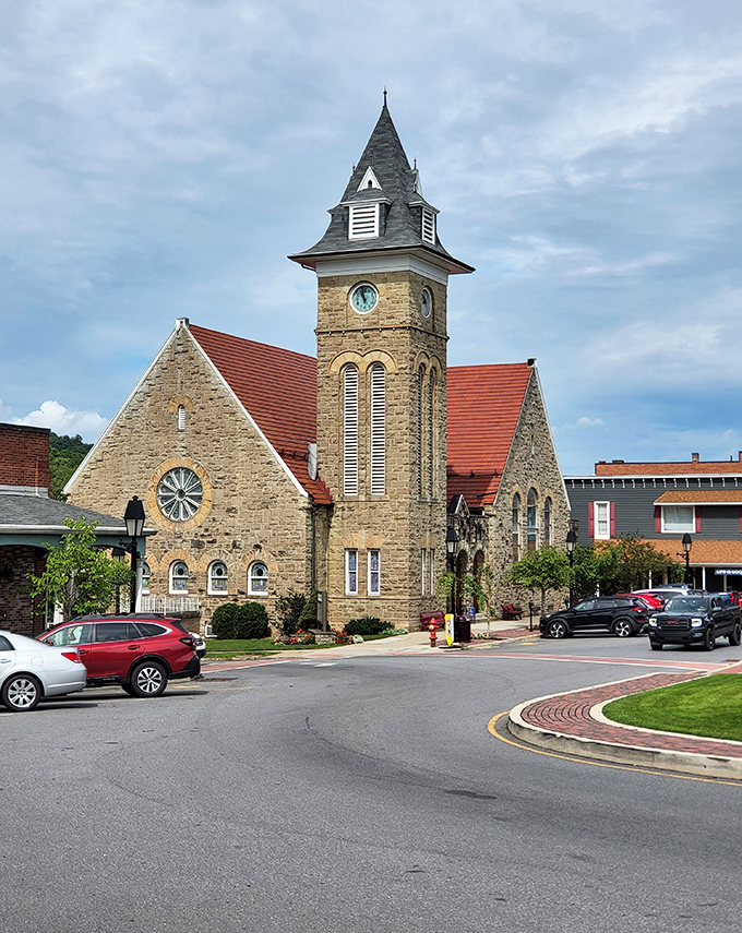 Stone church tower reaches skyward, anchoring community spirit with timeless architectural grace and dignity.