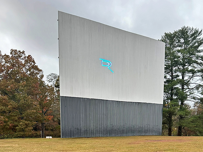 The massive screen stands sentinel against the changing seasons, its blue trim a beacon of entertainment in the North Georgia mountains.