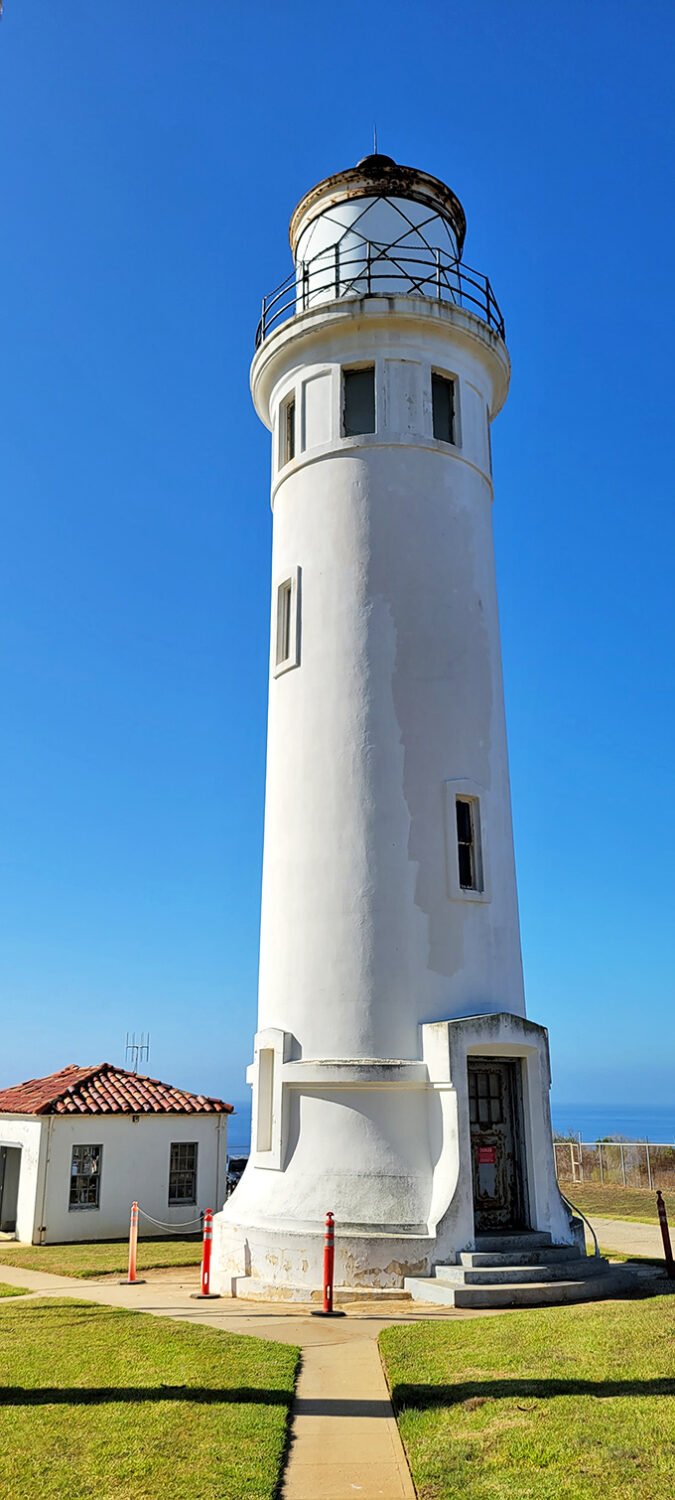 Standing tall and bright white against the blue, this lighthouse has better posture than most of us after decades on the job.