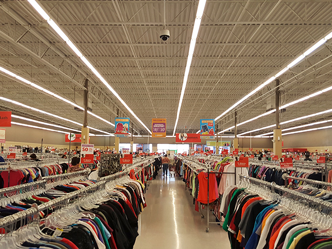 The clothing section stretches toward the horizon like a textile desert, each hanger a potential fashion oasis.