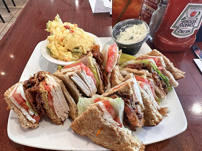 The club sandwich: three stories of delicious architecture that requires both hands, several napkins, and zero shame.