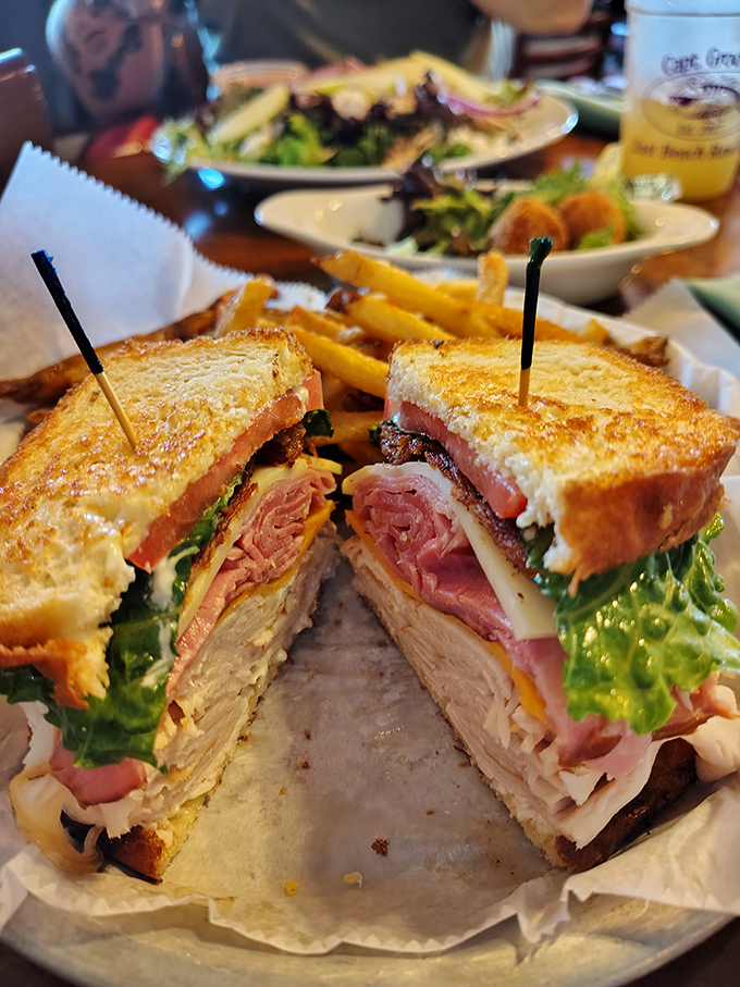 This isn't just a club sandwich&mdash;it's architecture. Layers of goodness stacked so perfectly you almost feel guilty dismantling it. Almost.