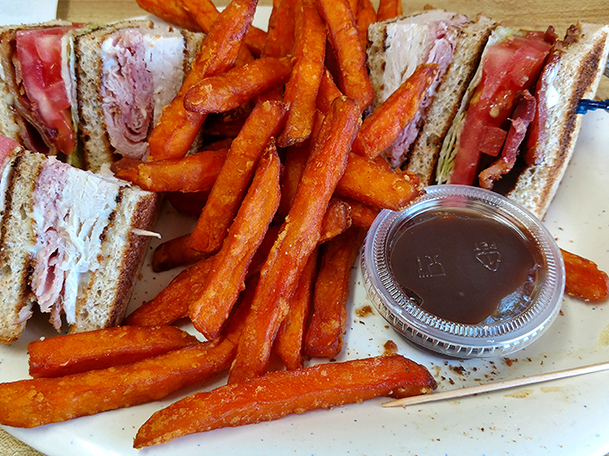 This club sandwich with sweet potato fries isn't trying to reinvent the wheel—it's just making that wheel deliciously satisfying.
