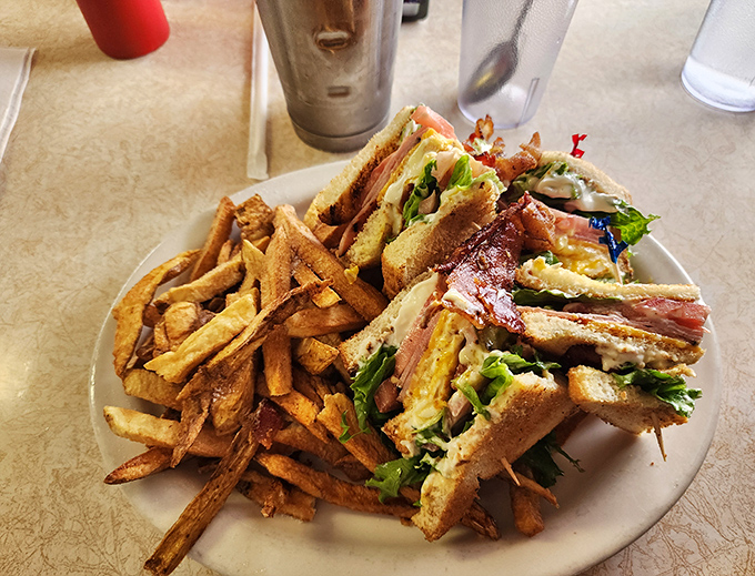The club sandwich &ndash; architecture you can eat. Three stories of deliciousness held together with toothpicks and tradition.
