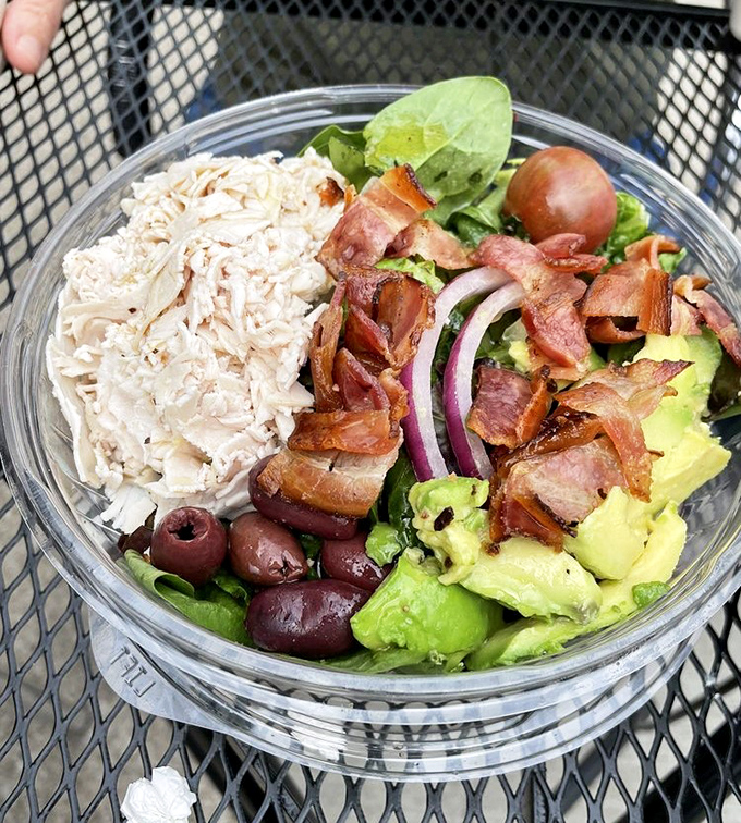 A salad that understands protein isn't just an afterthought. Chicken, bacon, avocado, and olives having the garden party of your dreams.