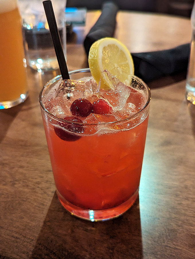 Cocktail o'clock never looked so good. This ruby-hued concoction with fresh cherries and lemon is what happens when bartenders double as artists.