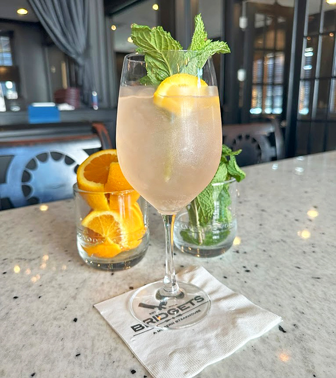 A cocktail that looks like summer vacation in a glass. That fresh mint and citrus garnish isn't just for show&mdash;it's the exclamation point on a liquid sentence.
