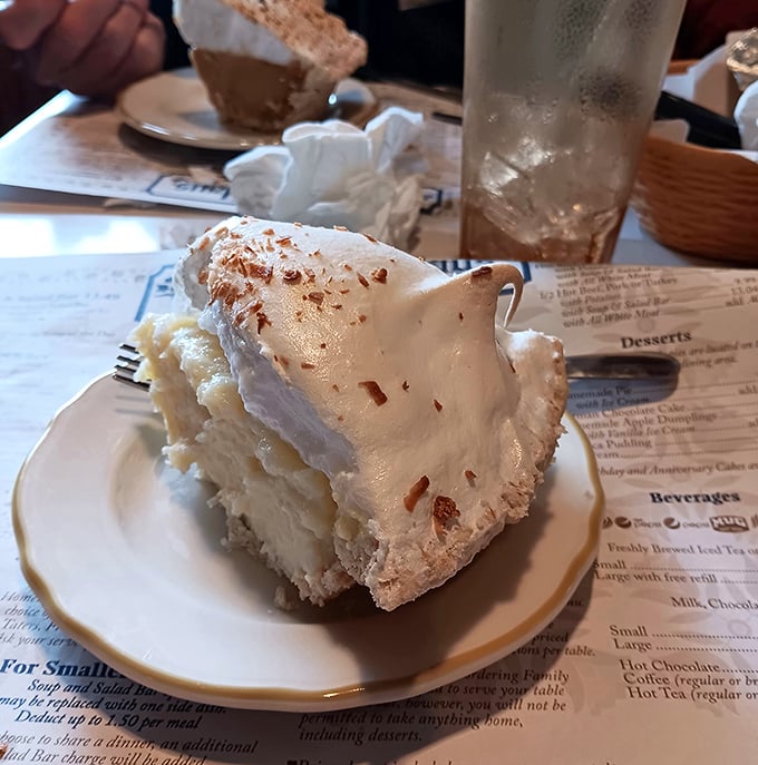 Coconut cream pie that whispers sweet promises and delivers on every single fluffy, dreamy forkful.