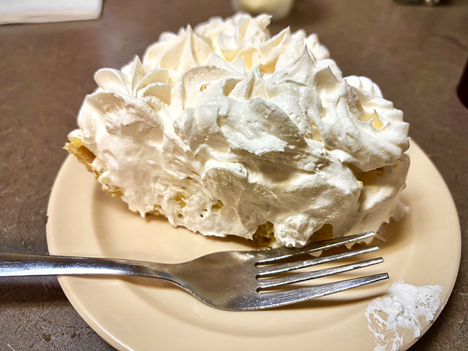 Coconut cream pie with peaks of whipped cream like Florida clouds. One bite and you'll understand why dessert is technically a breakfast food.