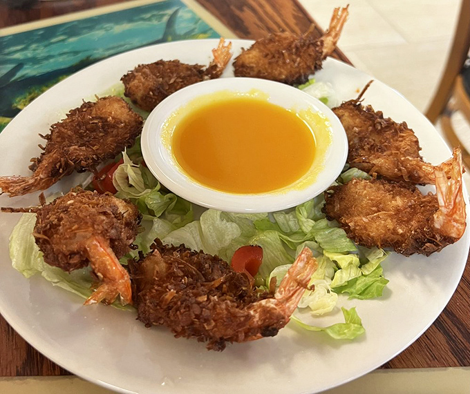 Coconut shrimp arranged like a crispy crown, each one a crunchy little treasure waiting to be discovered.