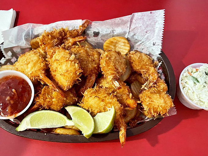 Golden coconut shrimp that crunch like autumn leaves, with sweet flesh inside that tastes like the ocean took a vacation in the tropics.
