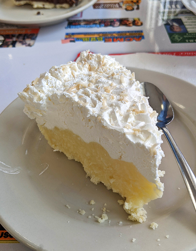 Coconut cream pie with a cloud of whipped topping so light it might float away if not anchored by that perfect buttery crust.