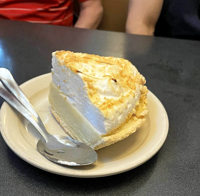 This slice of coconut cream pie isn't just dessert&mdash;it's a fluffy cloud of sweetness that makes you question why you ever considered saving room.