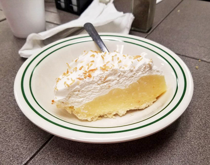 Coconut cream pie that would make your grandmother simultaneously proud and jealous. That cloud of whipped cream isn't just a topping—it's a lifestyle choice.