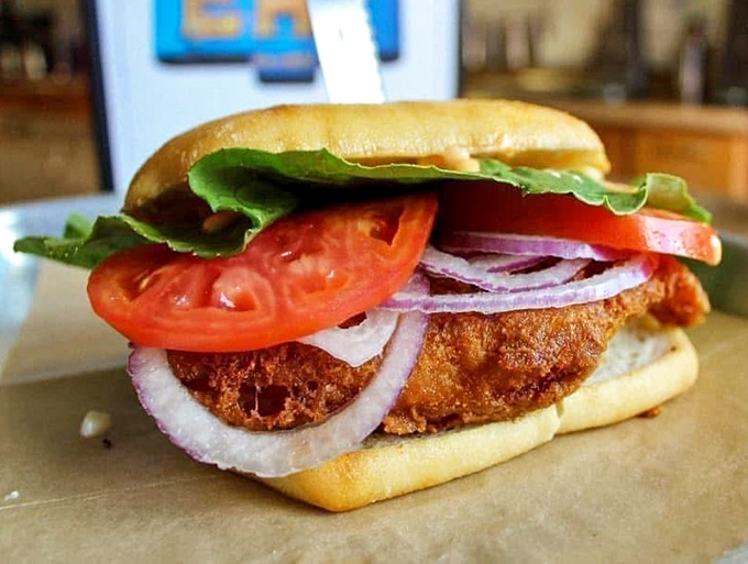 Wisconsin's Friday fish fry tradition gets the handheld treatment. This cod sandwich isn't just food—it's cultural heritage between bread.
