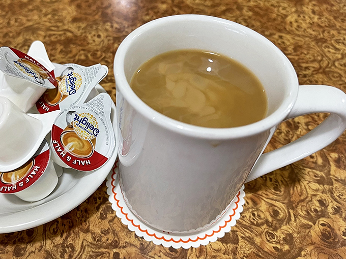 Coffee served in mugs substantial enough to warm both hands on a chilly morning. The universal fuel for conversation and contemplation. 