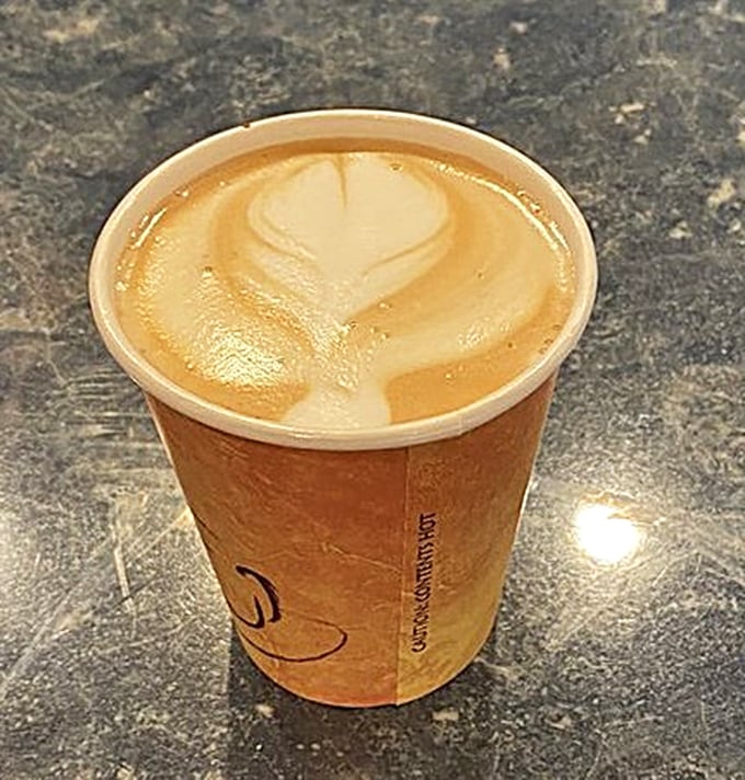 Latte art that's almost too pretty to drink. Almost. The heart design seems to say, "I was made with care just for you."