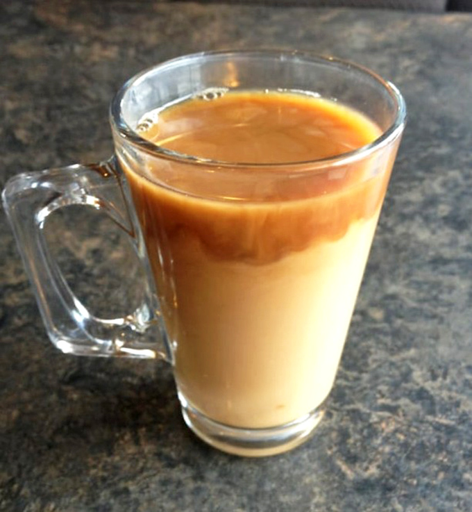 Coffee with that perfect caramel hue &ndash; not pretentiously artisanal, not shamefully instant. The kind that says, "Good morning" like it means it.