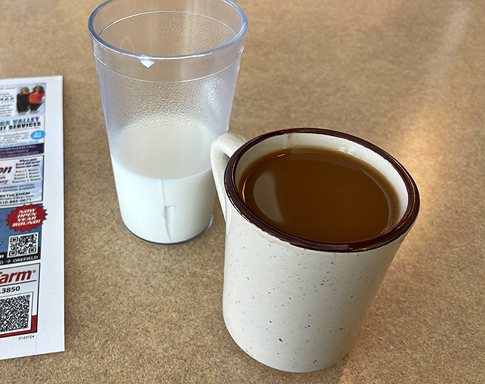 Coffee served in those sturdy mugs that feel like an old friend's handshake &ndash; the kind that keeps you warm long after the caffeine kicks in.