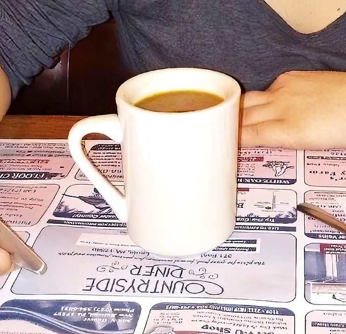 Simple coffee in a simple mug—the perfect dance partner for pastry extravagance. No foam art needed when the donuts are the real stars.