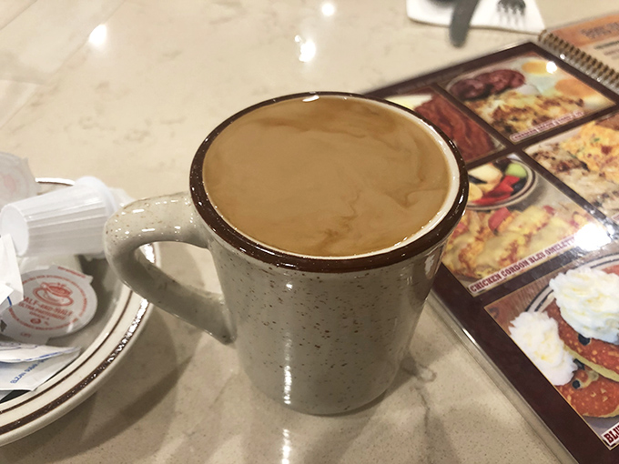 That classic diner coffee mug &ndash; sturdy, unpretentious, and promising unlimited refills that'll keep you chatting until closing time.