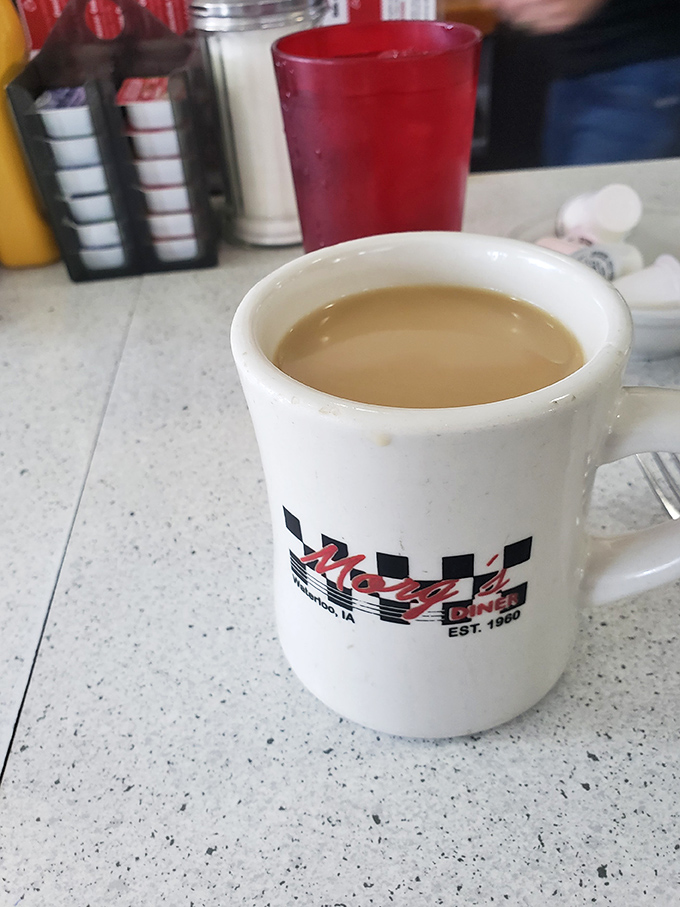 The checkered mug says it all&mdash;this isn't fancy coffee with Italian names, it's the honest brew that built America, one refill at a time.