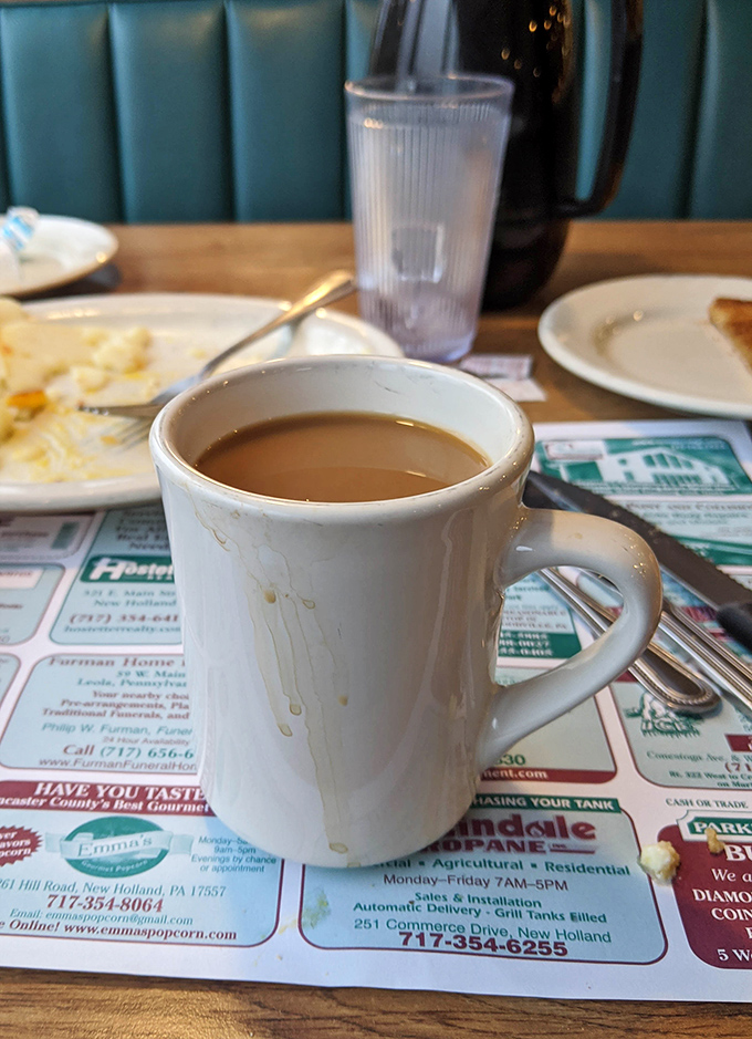Coffee served in the classic white mug&mdash;the universal symbol for "take a moment and breathe." Simple pleasures in a chaotic world. 