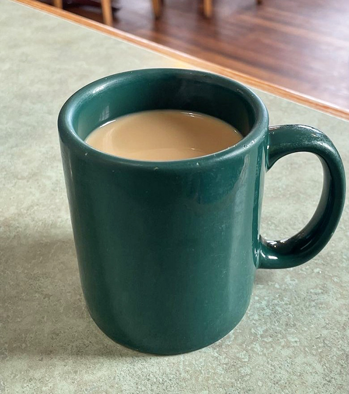 The humble green mug doesn't promise single-origin beans or artisanal foam art&mdash;just honest coffee that keeps coming until you surrender.