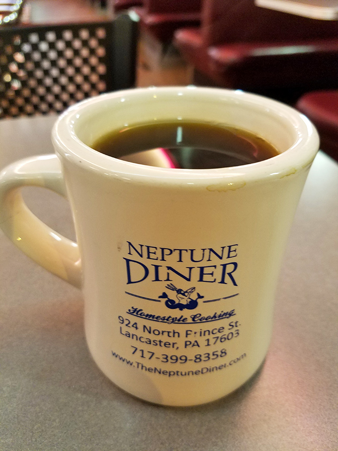That iconic white mug promises bottomless refills of liquid motivation. The Neptune Diner coffee&mdash;keeping Lancaster residents functional since day one.
