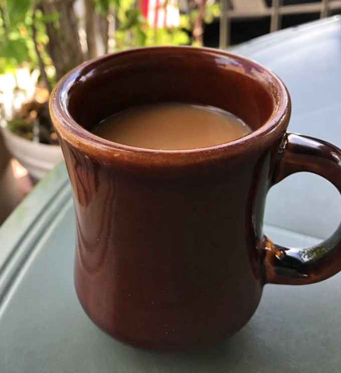 The sturdy brown mug says, "I'm not here to be photographed, I'm here to deliver caffeine." This coffee doesn't need a fancy name or artisanal credentials.