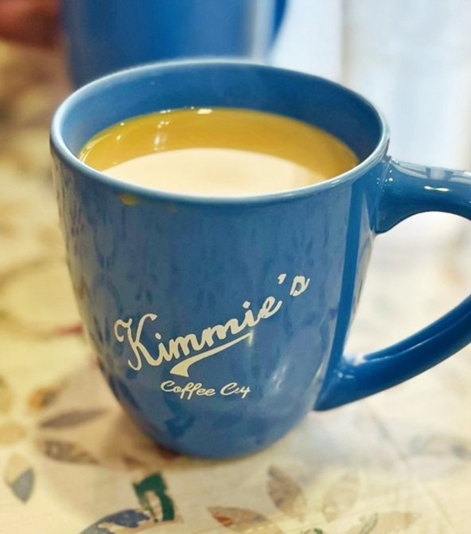 The blue mug isn't just holding coffee; it's cradling liquid motivation to face whatever Monday has in store.