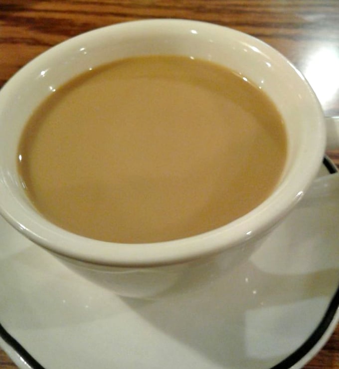 The lifeblood of any respectable diner &ndash; coffee served in that iconic thick white mug, promising to transform morning zombies into functioning humans.