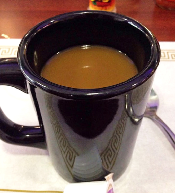That black coffee mug with the Greek key pattern&mdash;holding liquid motivation that keeps Columbus running. Simple, strong, and reliable, just like the diner itself.