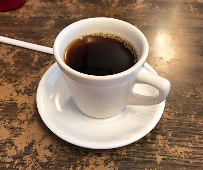 The humble white mug contains diner coffee in its purest form&mdash;strong enough to resurrect the dead but served with enough refills to make you feel truly alive.