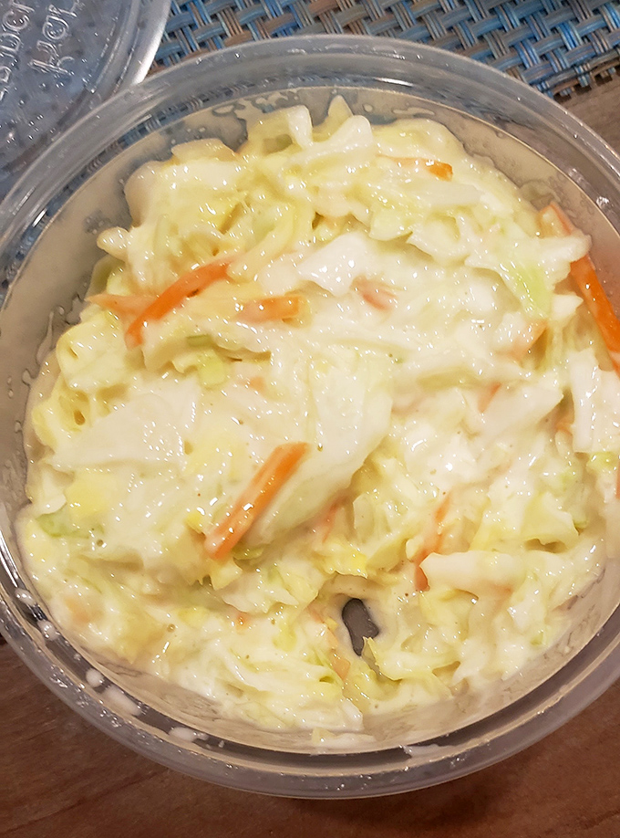 Coleslaw that knows its supporting role and plays it perfectly. Creamy, crunchy, and ready to cool down your palate between bites of fried goodness.