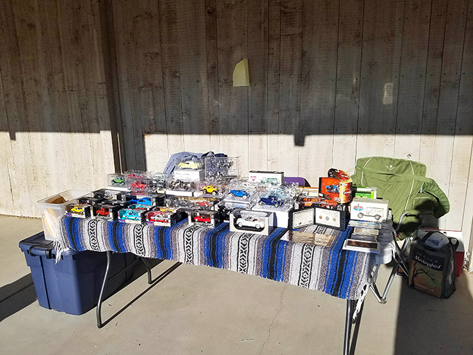 A vendor's table transforms ordinary Mexican blankets into a vibrant display of Southwestern color—portable sunshine you can take home.