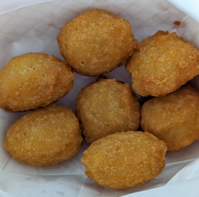 Corn fritters that would make your grandmother weep with joy. These golden orbs of happiness prove simplicity is the ultimate sophistication.