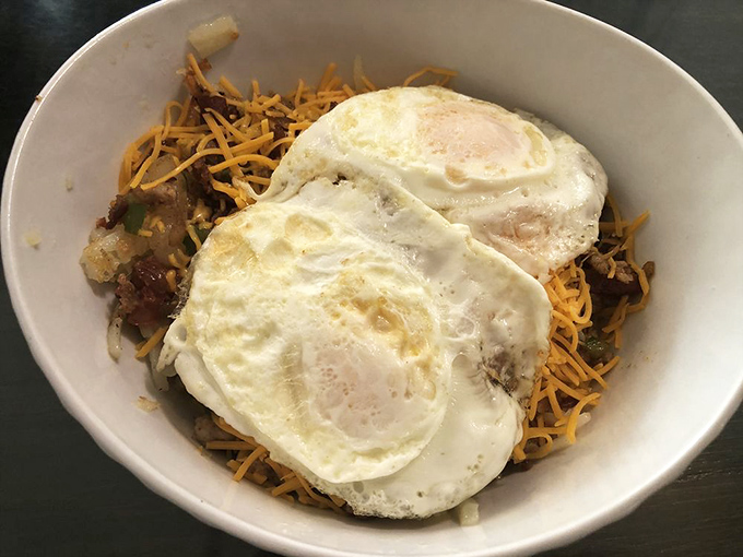 A hearty skillet topped with perfectly cooked eggs &ndash; where hash browns achieve their highest purpose in the breakfast universe.