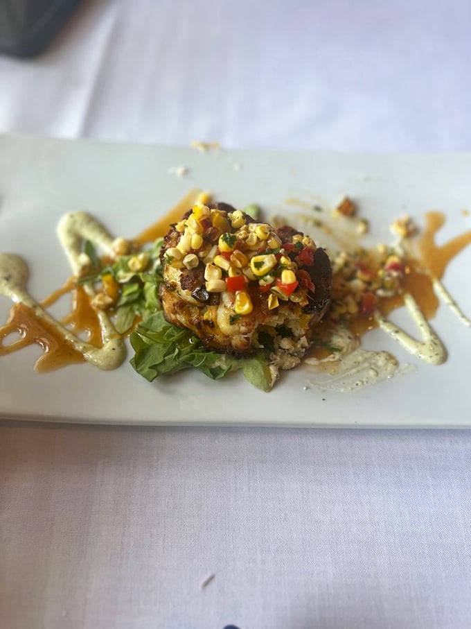 This crab cake isn't just golden-brown perfection; it's a disc of sweet crab meat with corn relish that makes you wonder why you'd eat anything else.