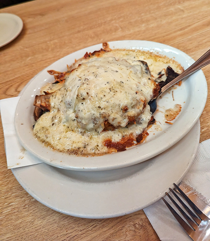 Cheese-smothered goodness that proves vegetables can be decadent too. This stuffed portobello is what mushrooms dream of becoming when they grow up.