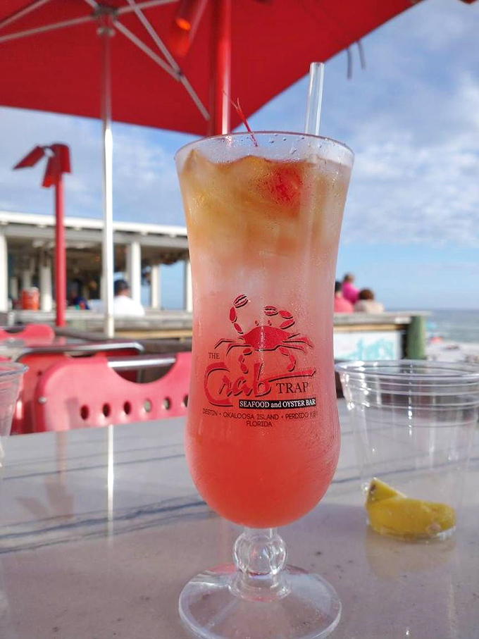 The Crab Trap Punch&mdash;a sunset in a glass that makes you wonder if they somehow bottled Florida's famous golden hour.