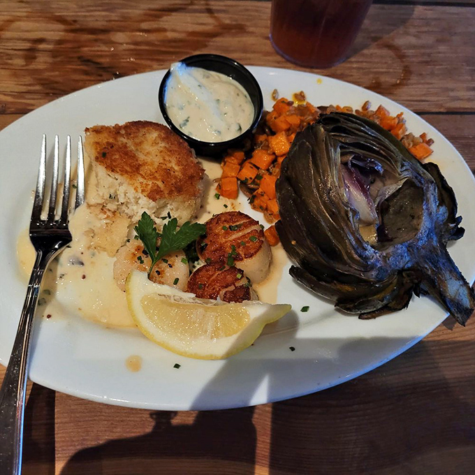 The crab cake and scallop combo plate&mdash;where "sharing is caring" meets "get your own, this is too good to divide."