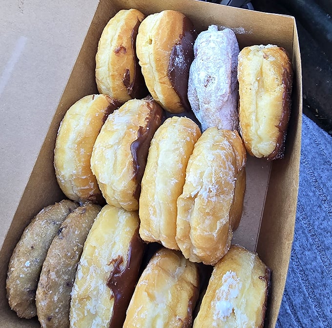 Long johns lined up like sweet soldiers, each one topped with enough frosting to make your dentist weep.