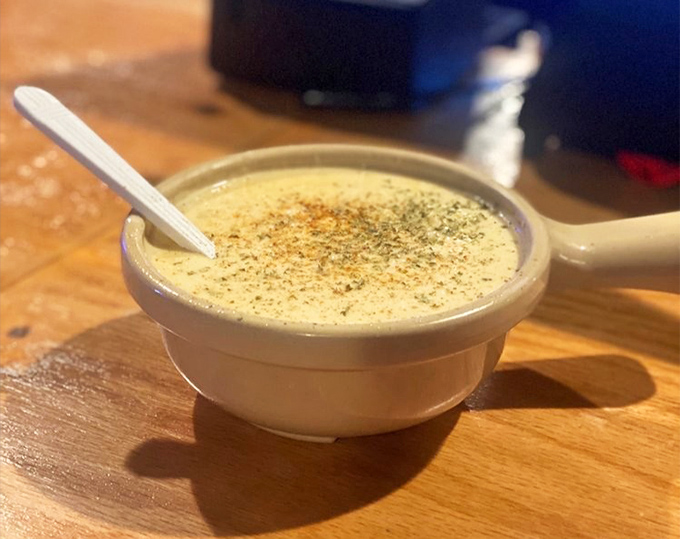 This cream of crab soup isn't just a starter&mdash;it's a warm, velvety embrace in a bowl, topped with a sprinkle of spice that whispers, "Welcome home."