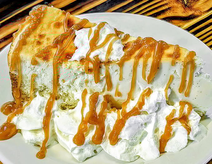 Dessert that doesn't know the meaning of restraint. Caramel drizzled over cream like a Jackson Pollock painting you can actually eat.