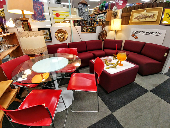 Mid-century modern heaven! This vibrant red sectional is waiting for someone to recreate their own Mad Men living room scene.