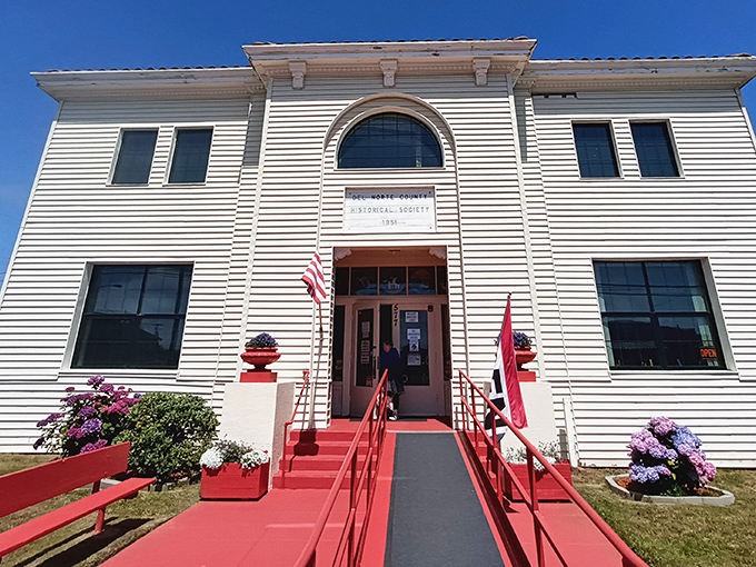 The Del Norte Historical Society building welcomes visitors with bright red steps. Inside, the county's colorful past comes alive through artifacts that survived tsunamis, earthquakes, and changing times.