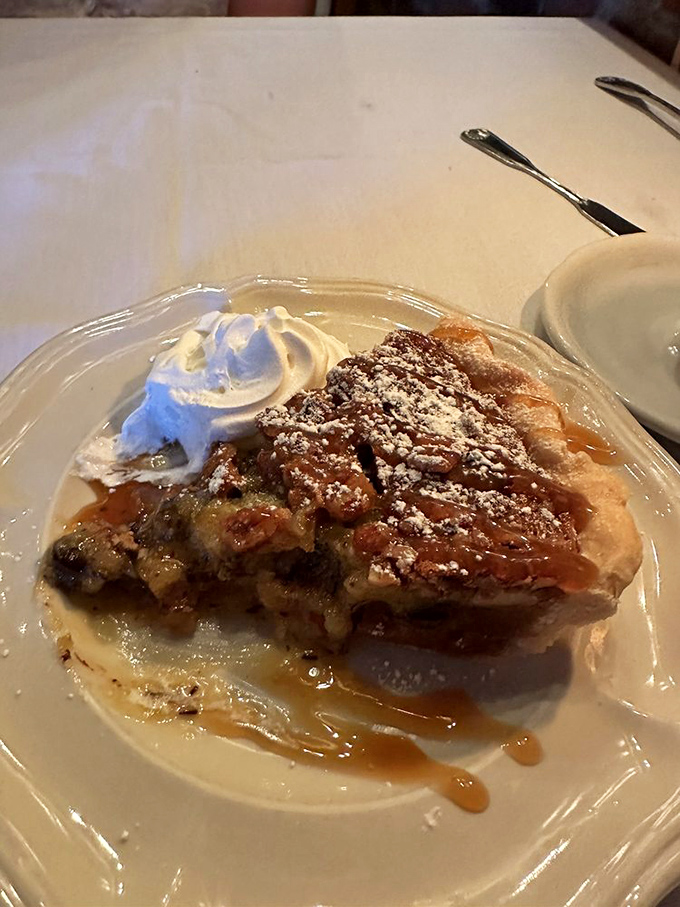 Derby pie with a cloud of whipped cream&mdash;because sometimes dessert should wear a fancy hat too.